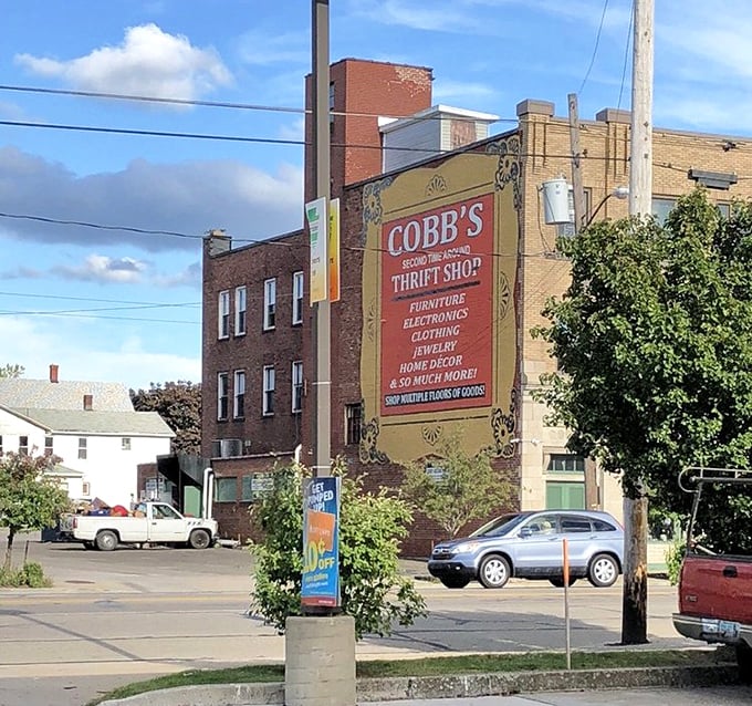 Cobb's painted storefront sign tells you everything - furniture, electronics, clothing, and so much more awaits inside.