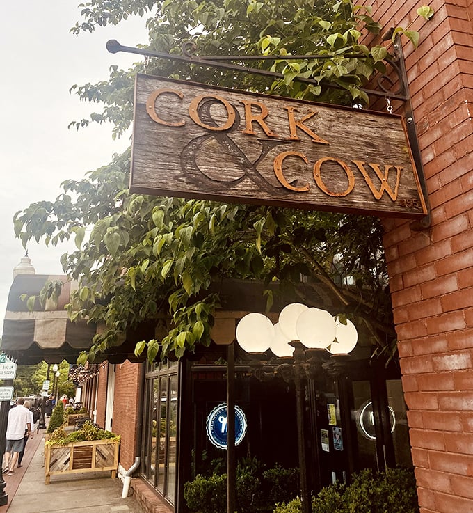 That handcrafted wooden sign whispers sophistication while the cozy entrance promises comfort food bliss.
