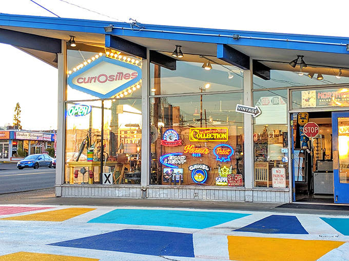 Window displays bursting with vintage signs and colorful treasures – like peeking into a time capsule curated by a design genius.