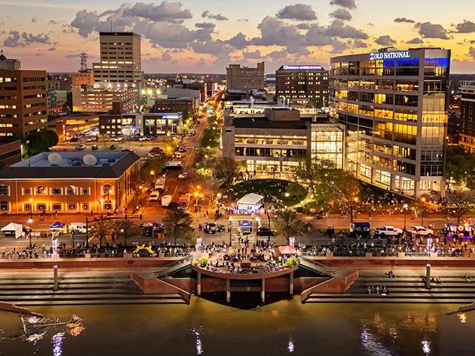 The River city spreads out below like a comfortable quilt stitched together with care and time.