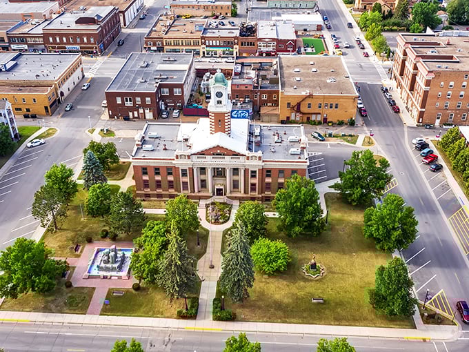 An aerial view of Hibbing highlights its stately courthouse and tree-lined downtown — a proud reflection of small-town Minnesota heritage.