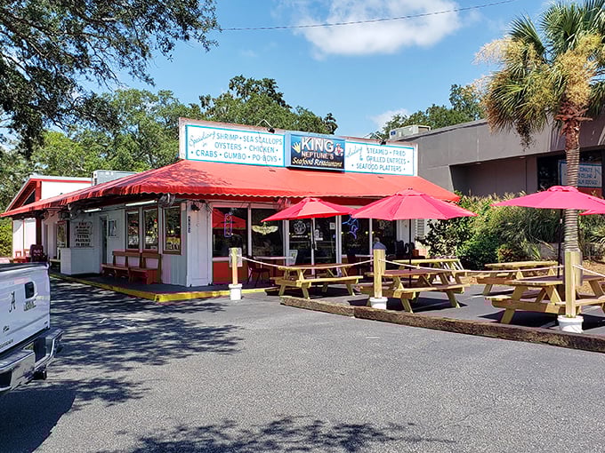 That red and white awning beckons like a lighthouse for hungry souls seeking genuine coastal flavors.