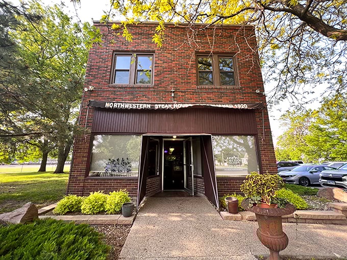 Daylight reveals Northwestern's classic brick charm – a steakhouse that's been converting vegetarians since before your grandparents had their first date.