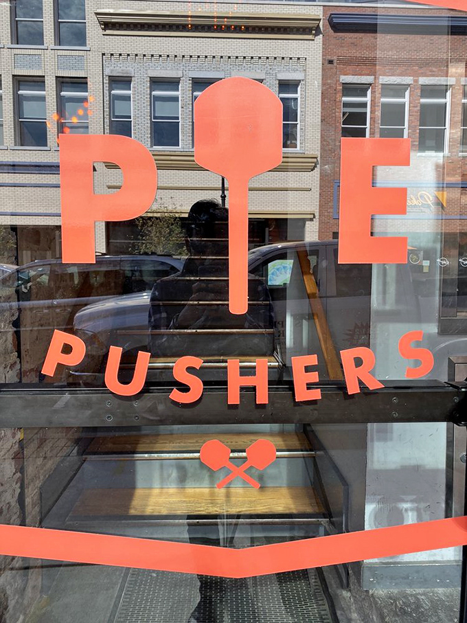 The bold "PIE PUSHERS" lettering says it all – these folks take their pizza mission seriously. And we're grateful they do!