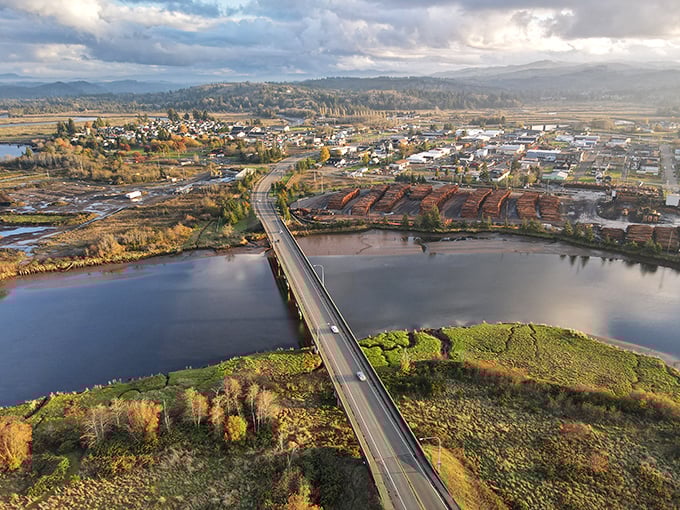 Soaring above Raymond, where the bridge connects more than just riverbanks—it links logging history with small-town present in a patchwork of water, woods and wonder.