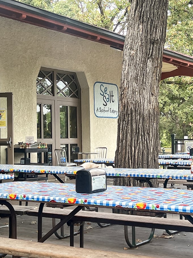Those colorful picnic tables aren't just seating—they're front-row tickets to Minnesota's most delicious seafood show.