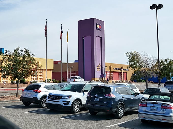 Purple towers rise like retail beacons, guiding smart shoppers toward deals that'll make their wallets smile.