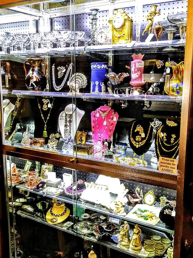 Not just jewelry – personal history in glass cases. Each necklace and figurine represents someone's special occasion, now waiting for its sequel.