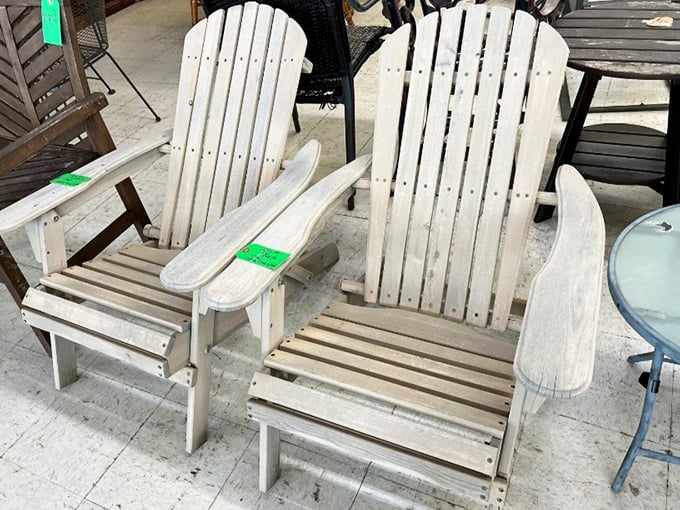 Weathered Adirondack chairs waiting for their second act. Perfect for summer evenings on the porch with a glass of sweet tea and zero buyer's remorse.