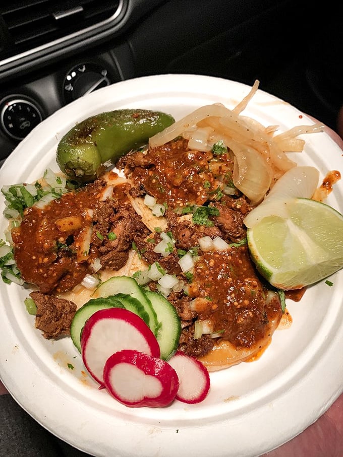 Al pastor perfection: A symphony of marinated pork, caramelized edges, fresh cilantro, and that crucial pineapple crown. Poetry on a paper plate.