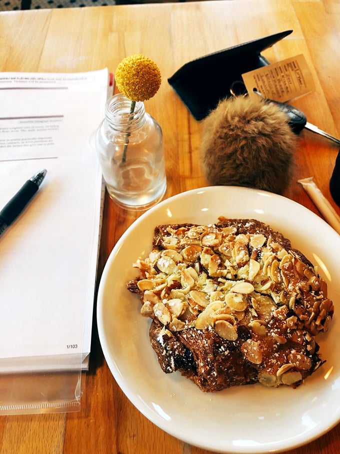 This almond croissant isn't just topped with nuts—it's wearing a crown fit for pastry royalty, with caramelized edges that crackle like nature's candy.
