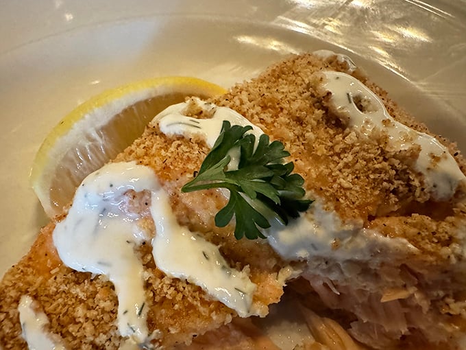 The almond-crusted walleye arrives like Wisconsin on a plate—golden, crispy, and ready to make you forget every fish you've eaten before.