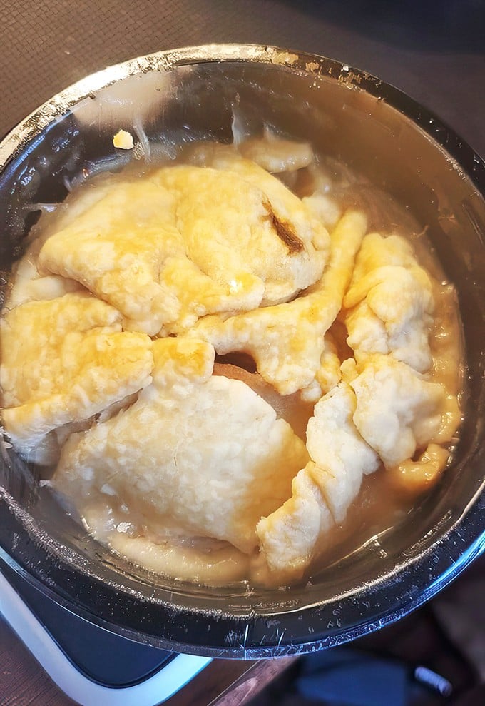 Pillowy dumplings swimming in golden broth—proof that simplicity, when done right, outshines fancy cuisine every time.