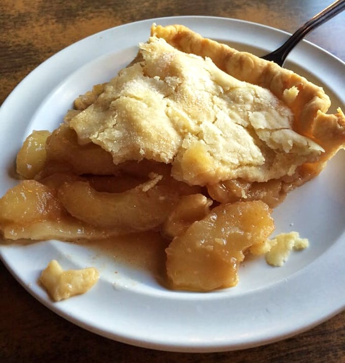 The holy grail of desserts! Golden, flaky crust cradles tender apple slices swimming in cinnamon-spiced glory—worth every mile of your journey.