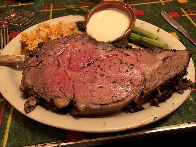 This isn't just prime rib – it's a masterpiece of meat, perfectly pink and tender enough to cut with a whisper, served with sides that know their supporting role. 