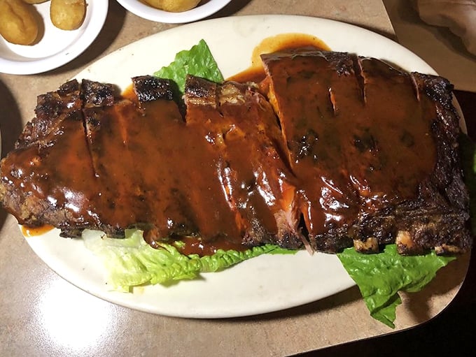 Glistening ribs that would make Fred Flintstone jealous. That sauce doesn't just coat the meat—it becomes one with it.