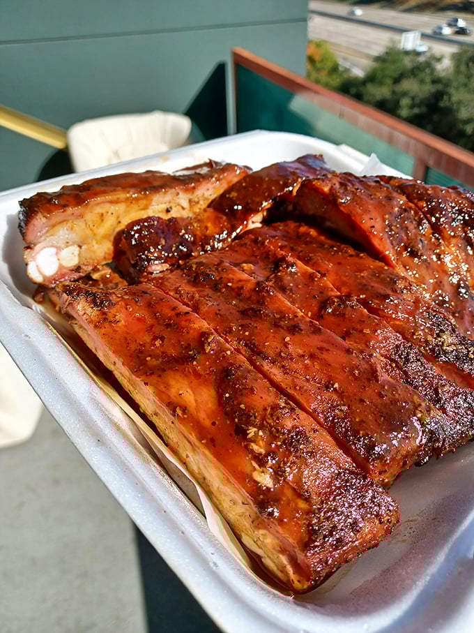 These ribs don't just fall off the bone—they practically leap into your mouth with a perfect lacquered glaze that whispers, "Resistance is futile."