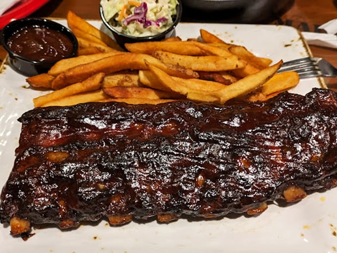 These BBQ ribs aren't just falling off the bone—they're practically jumping onto your fork, glistening with sauce that balances sweet, tangy, and smoky.