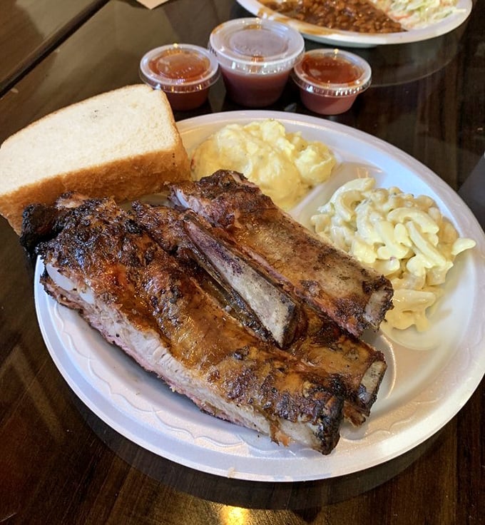 These ribs don't need a filter—that smoke ring is the real deal, a pink badge of honor earned through hours of patient smoking.