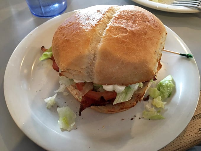 This BLT isn't just a sandwich—it's architecture with purpose. Crisp lettuce, juicy tomato, and bacon that snaps like a perfect punchline.