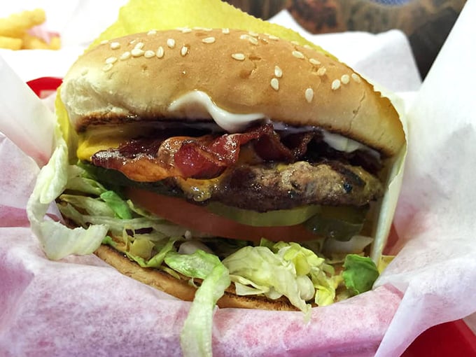 This isn't just a bacon cheeseburger – it's edible architecture where each layer plays its part in a symphony of satisfaction.