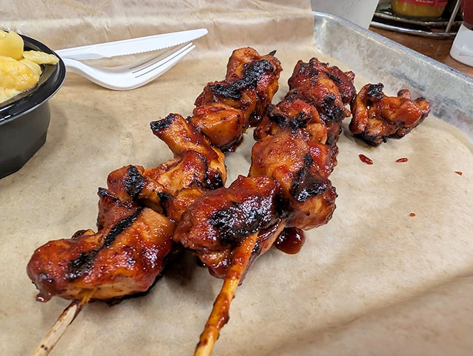 These glazed chicken skewers aren't just cooked, they're transformed—wearing their char marks like badges of honor earned in the smoker's chamber.