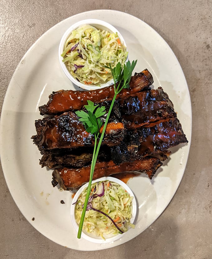 This barbecue doesn’t just satisfy—it practically sings, with smoky bites balanced by creamy coleslaw that cuts through the richness perfectly.