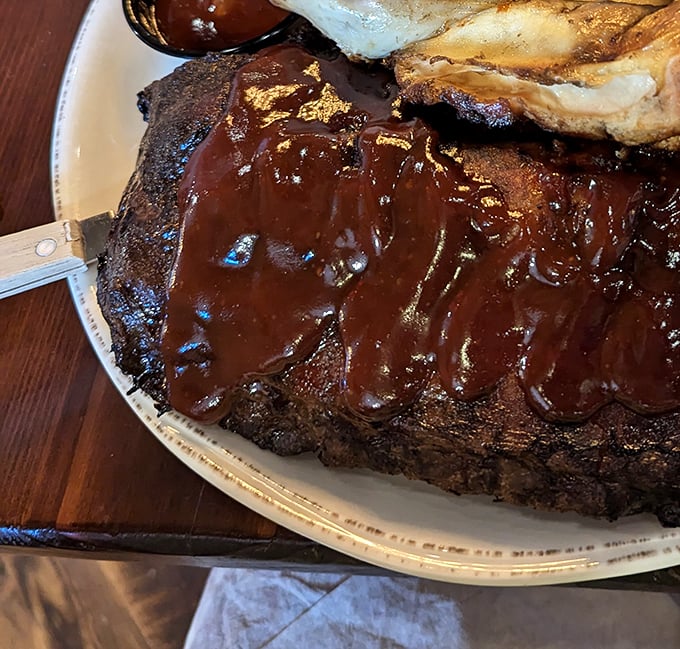 That brisket bark could make a vegetarian question everything—dark, crusty perfection that whispers sweet, smoky promises.