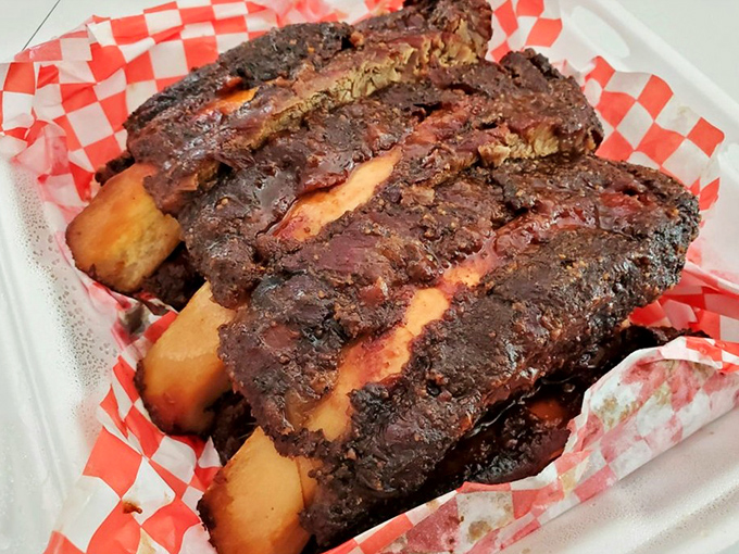 These beef ribs aren't just dinner—they're prehistoric monuments to smoke and patience. Fred Flintstone would approve.