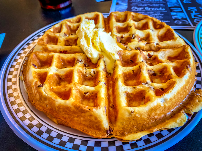 This Belgian waffle doesn't need a passport to impress. Golden, crispy exterior with those perfect butter-catching squares—architecture you can eat.