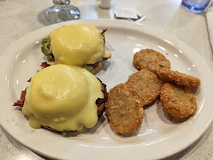 These Eggs Benedict aren't just breakfast—they're edible architecture, with hollandaise cascading like yellow velvet over perfectly poached eggs.