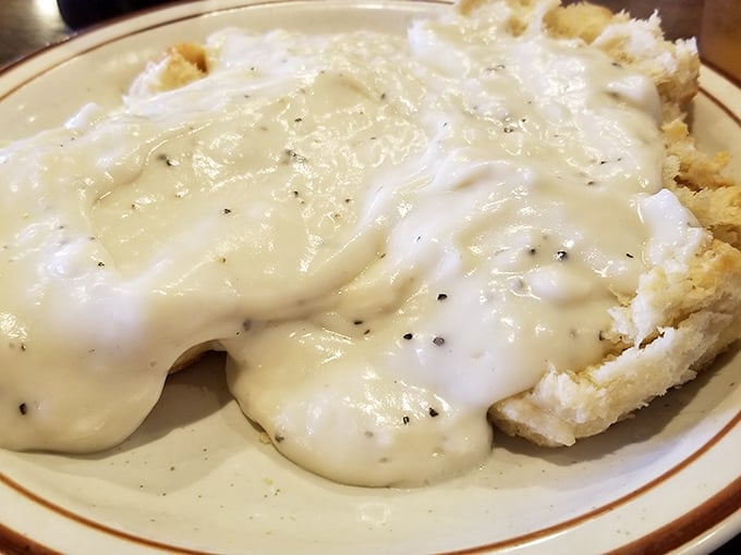 This isn't just biscuits and gravy – it's a cloud of dough baptized in peppery cream that might make you weep with joy.