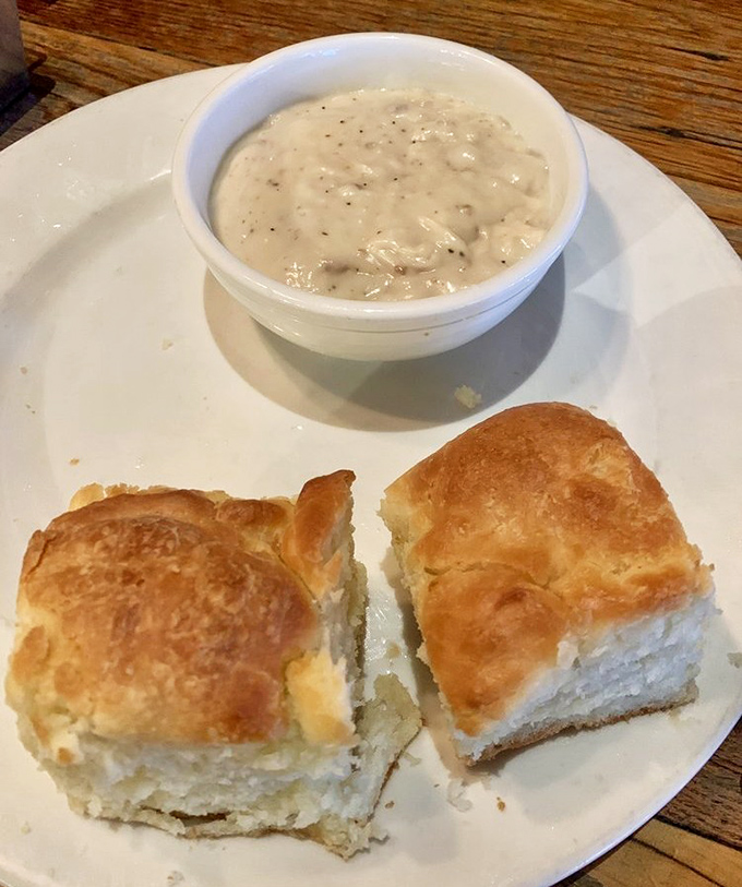 Golden biscuits with cloud-like interiors meet their soulmate in creamy, pepper-flecked gravy – a Tennessee love story.