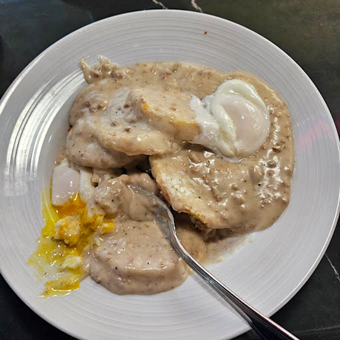 Behold the legendary biscuits and gravy – a velvety, peppery blanket of sausage-studded salvation that's cured more Vegas hangovers than all the aspirin in Nevada.