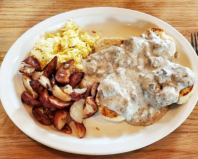 Biscuits and gravy that could start a religion. Fluffy islands of dough swimming in a sea of peppery sausage gravy – breakfast nirvana has been achieved.