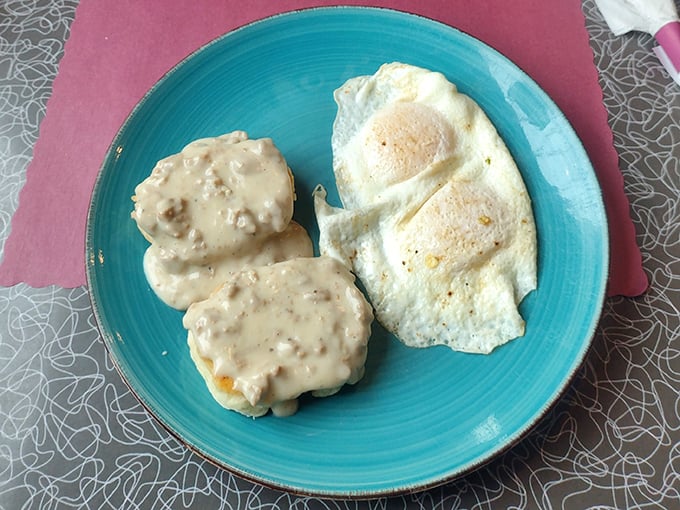 Biscuits smothered in sausage gravy alongside perfectly fried eggs – the breakfast equivalent of winning the lottery.