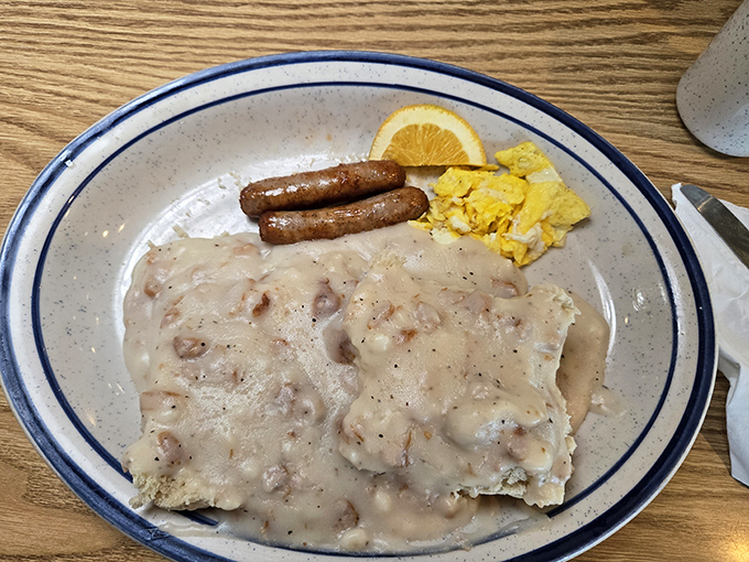 Biscuits and gravy that don't mess around – a hearty plate where creamy country gravy blankets everything in comforting, peppery goodness.