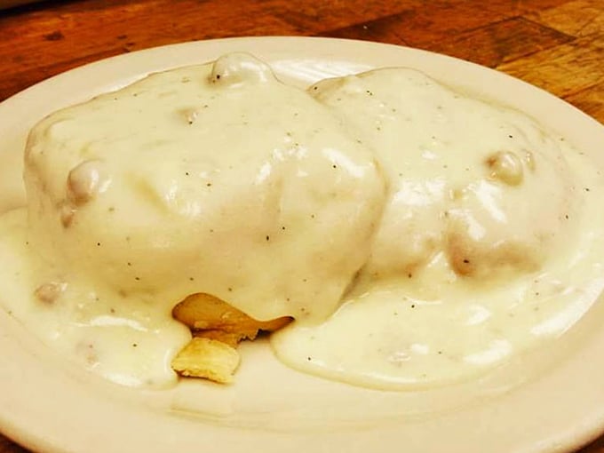 Behold the star attraction: biscuits drowning in creamy, peppery gravy studded with sausage. This isn't a meal—it's an edible hug on a plate.