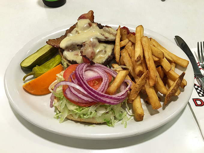 This isn't just a burger—it's the Blues Burger in all its melty, messy glory, where blue cheese doesn't sing the blues but makes you forget them.