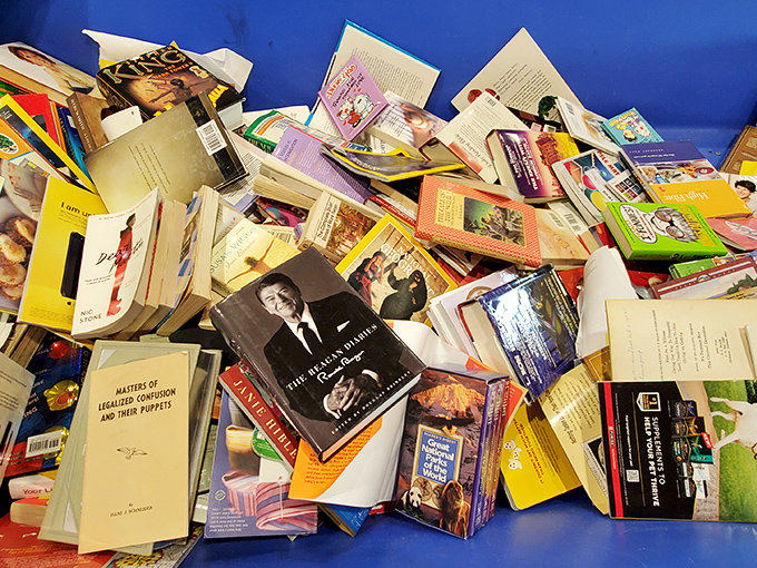 Literary chaos at its finest – somewhere in this pile, your next favorite book is hiding.