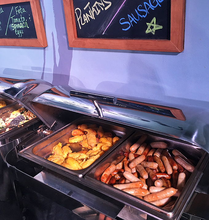 Breakfast buffet nirvana: where sausages and plantains coexist in perfect harmony, like the culinary equivalent of world peace.