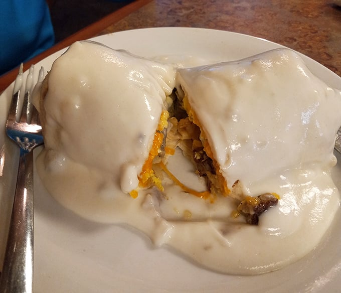 This breakfast burrito isn't just covered in gravy—it's smothered in possibility. A morning masterpiece that demands a knife and fork.