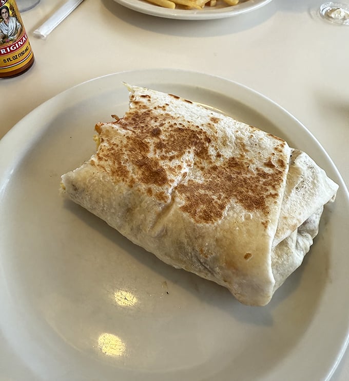 Behold the legendary breakfast burrito—grilled to golden perfection, stuffed with morning magic, and worth every mile of your pilgrimage.