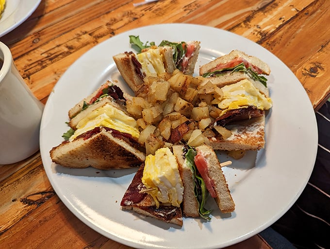 Behold the legendary Breakfast Club sandwich—architectural perfection with layers of egg, bacon, and veggies arranged like edible modern art.