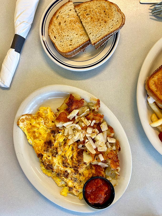 This Western omelet doesn't just satisfy hunger – it conquers it. Paired with perfectly crispy home fries and toast, it's the breakfast of champions.