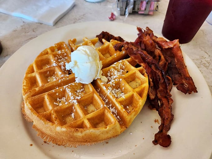Waffles and bacon performing their morning duet – crispy, sweet, and utterly shameless about being perfect together.