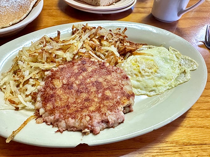 This isn't just breakfast – it's edible sunshine on a plate, with eggs cooked to perfection alongside crispy home fries that could make a potato proud.