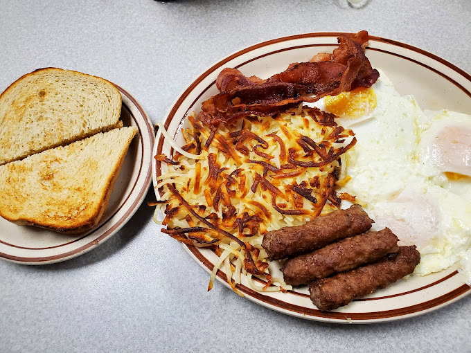 Breakfast nirvana on a plate – those hash browns are the crispy-edged, golden masterpieces that chain restaurants can only dream about creating.