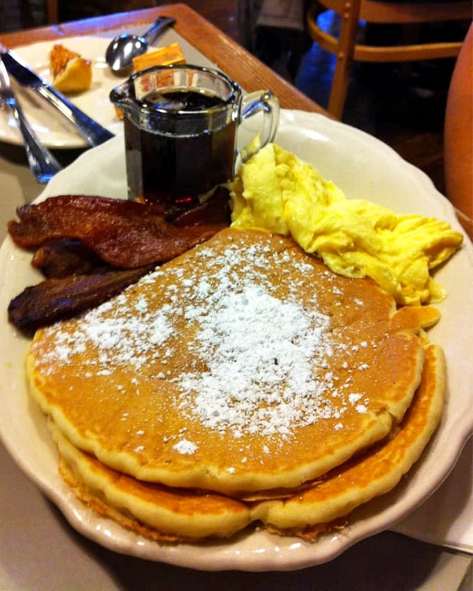 Golden pancakes dusted with powdered sugar, scrambled eggs, bacon, and syrup on standby—this is what Saturday mornings were invented for, folks.