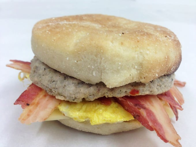 Breakfast architecture at its finest – a perfectly constructed sandwich where every layer deserves its own thank-you note.